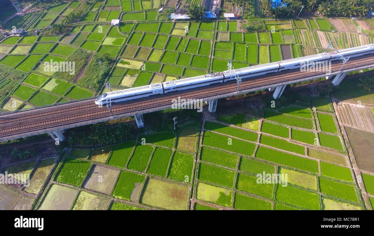Beijing, China's Hainan Province. 18th Jan, 2018. A bullet train runs ...