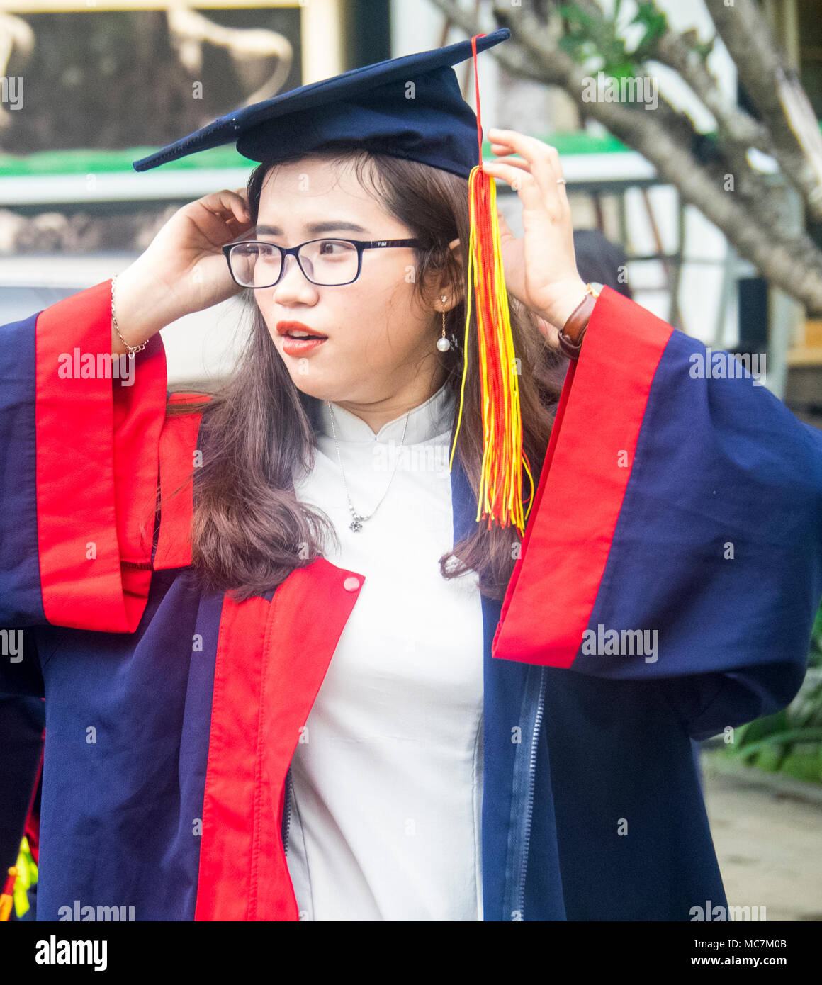 Woman wearing graduation cap gown hi-res stock photography and images ...