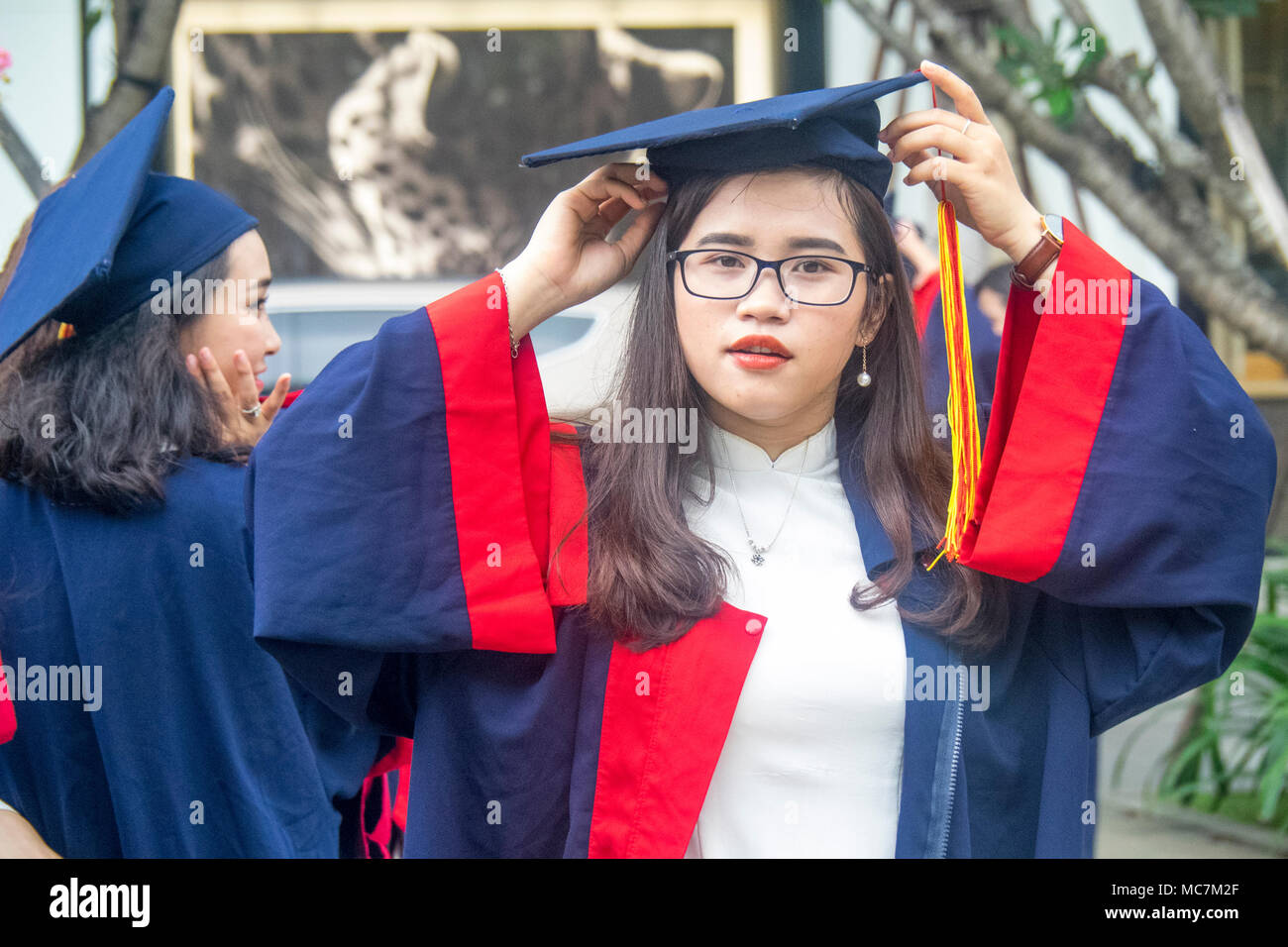Female university graduates wearing their academic gowns, on Nguyen Hue ...