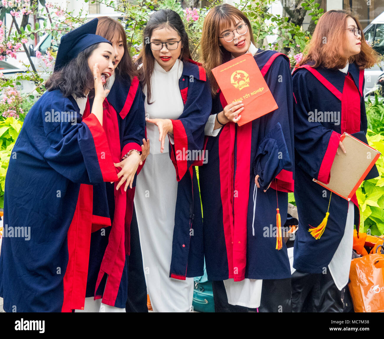 Female university graduates wearing their academic gowns, on Nguyen Hue ...