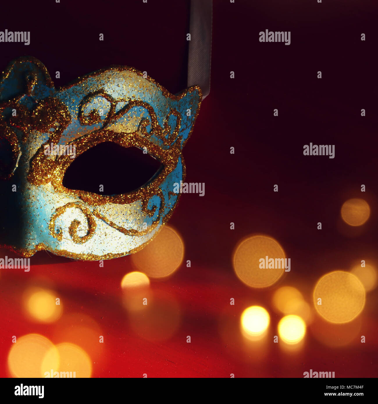 Image of elegant blue and gold venetian mask over red background Stock ...