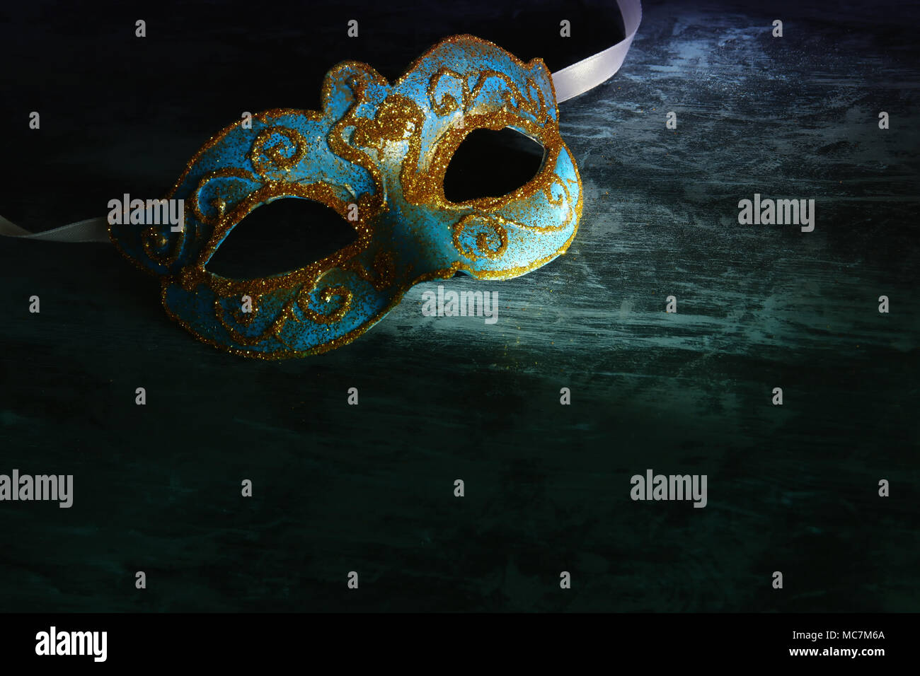 Image of elegant blue and gold venetian, mardi gras mask over black ...