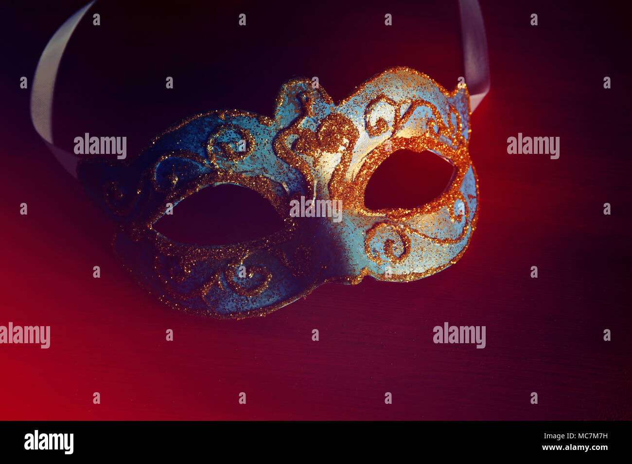 Image of elegant blue and gold venetian mask over red background Stock ...