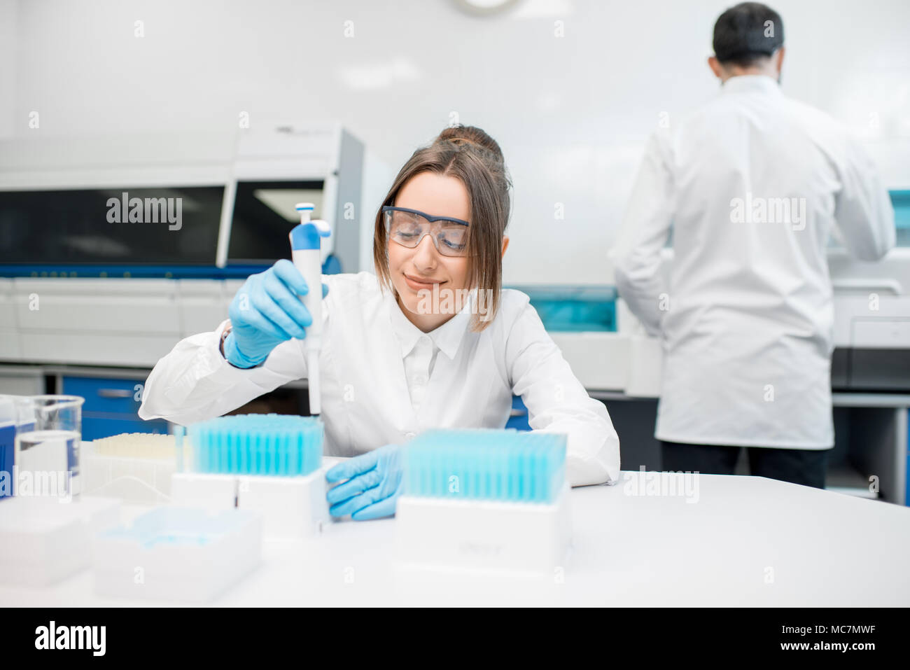 Doctor working biochemistry analyzer in hi-res stock photography and ...
