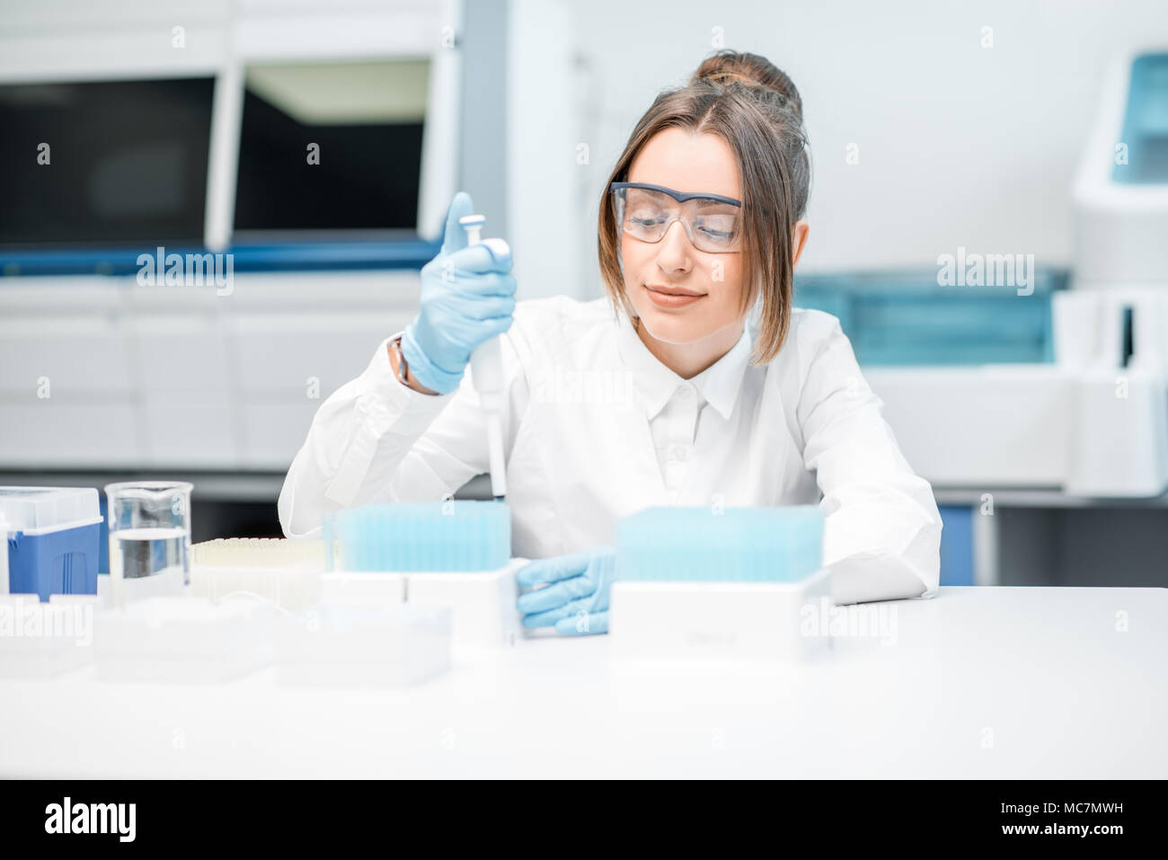 Doctor working biochemistry analyzer in hi-res stock photography and ...