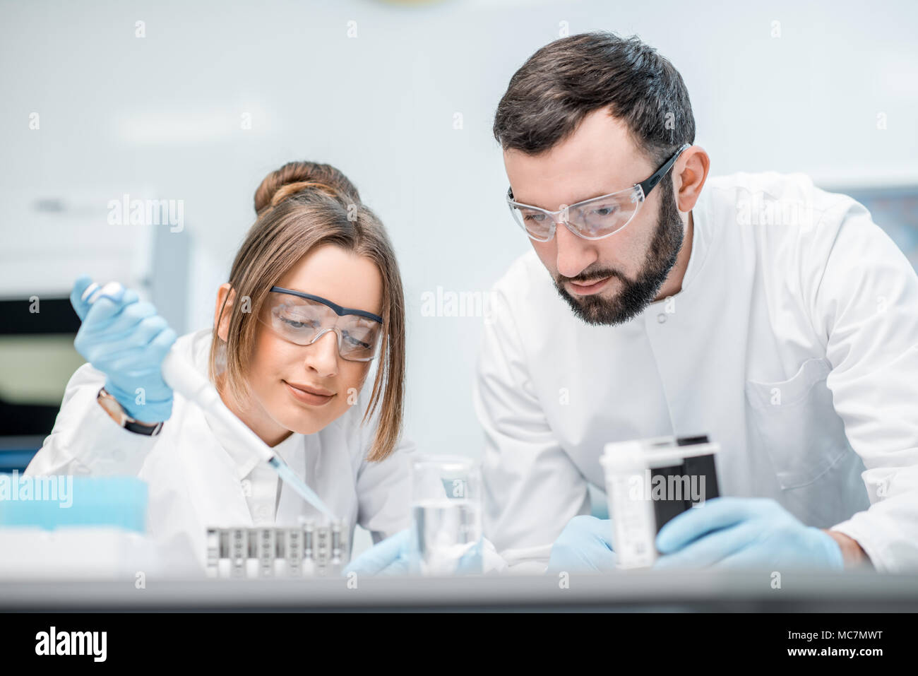 Doctor working biochemistry analyzer in hi-res stock photography and ...