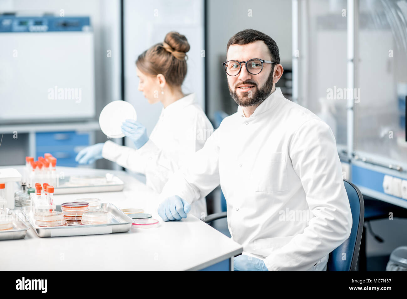 Portrait of a man in medical uniform during the bacteriological tests ...