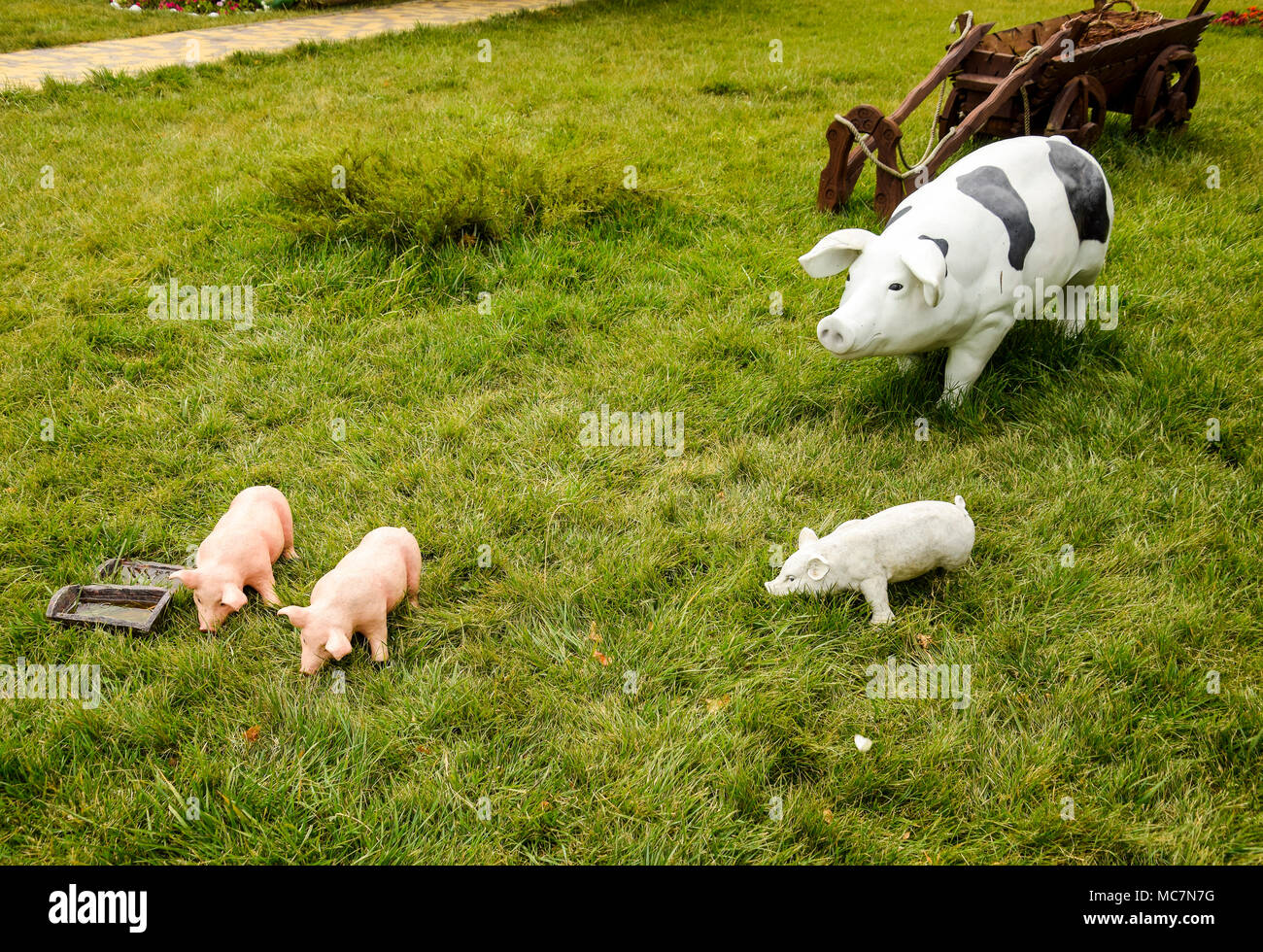Plastic toy pig. Figures pigs on the lawn Stock Photo - Alamy