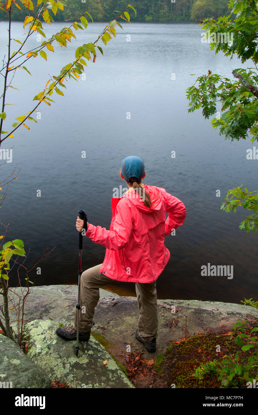 Hiker at Green Fall Pond along Narragansett Trail, Pachaug State Forest ...