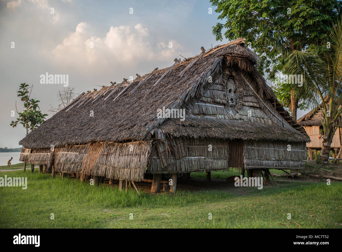 Haus Tambaran (men's or spirits house) decorated with a wood carved ...