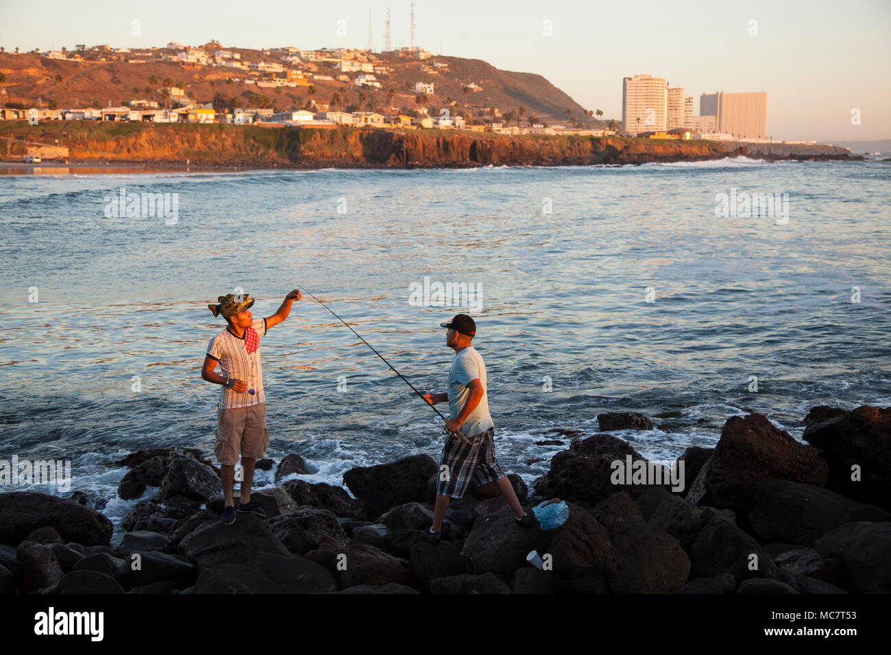 Boys fishing off the rocks Popotla, Rosarito, Baja California, Mexico ...