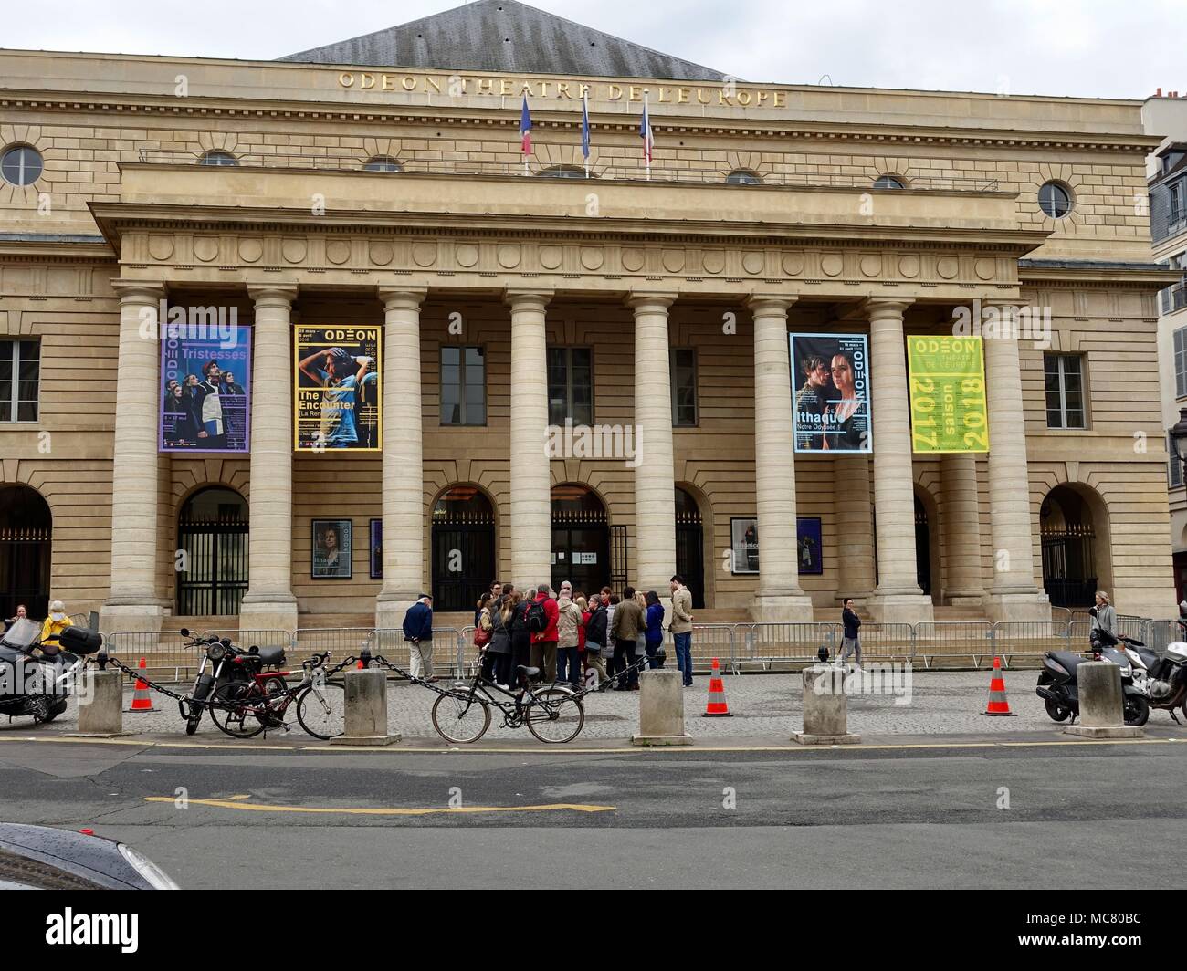 Large tour group meeting in front of the Odeon theatre. Place de l ...