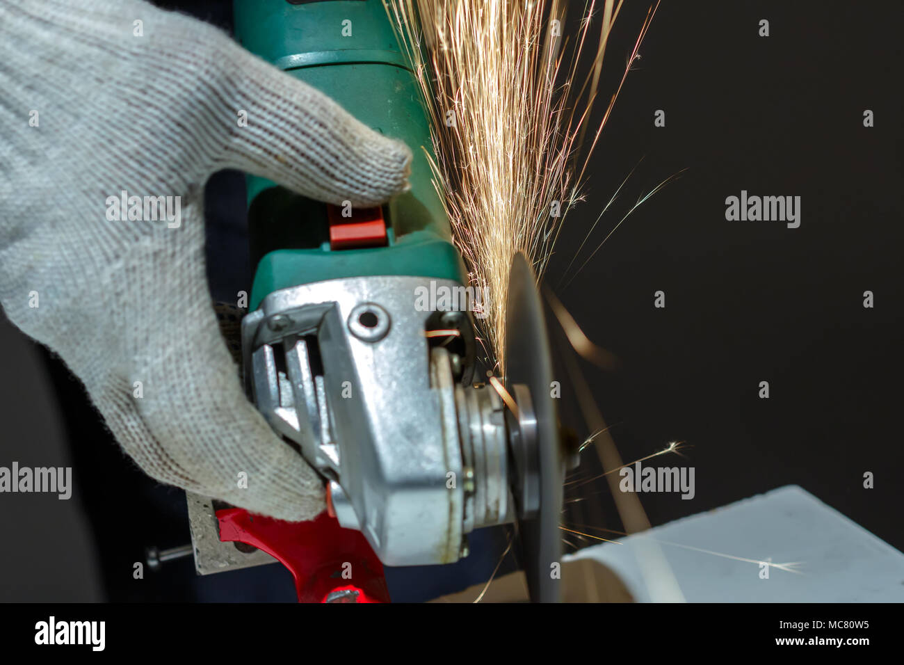 Angle grinder make a flash sparks Stock Photo - Alamy