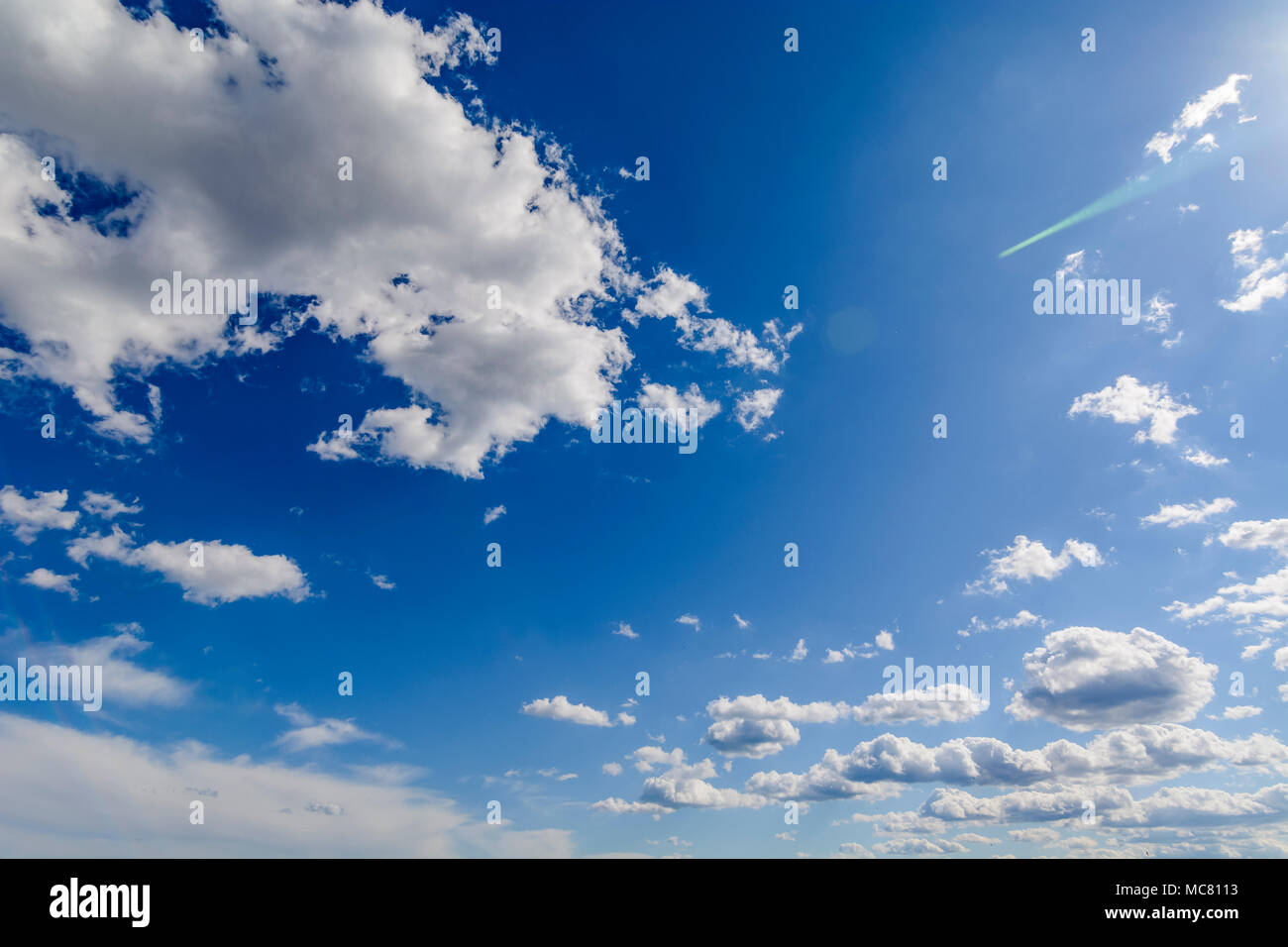 Sunny blue sky with clouds in spring time Stock Photo - Alamy