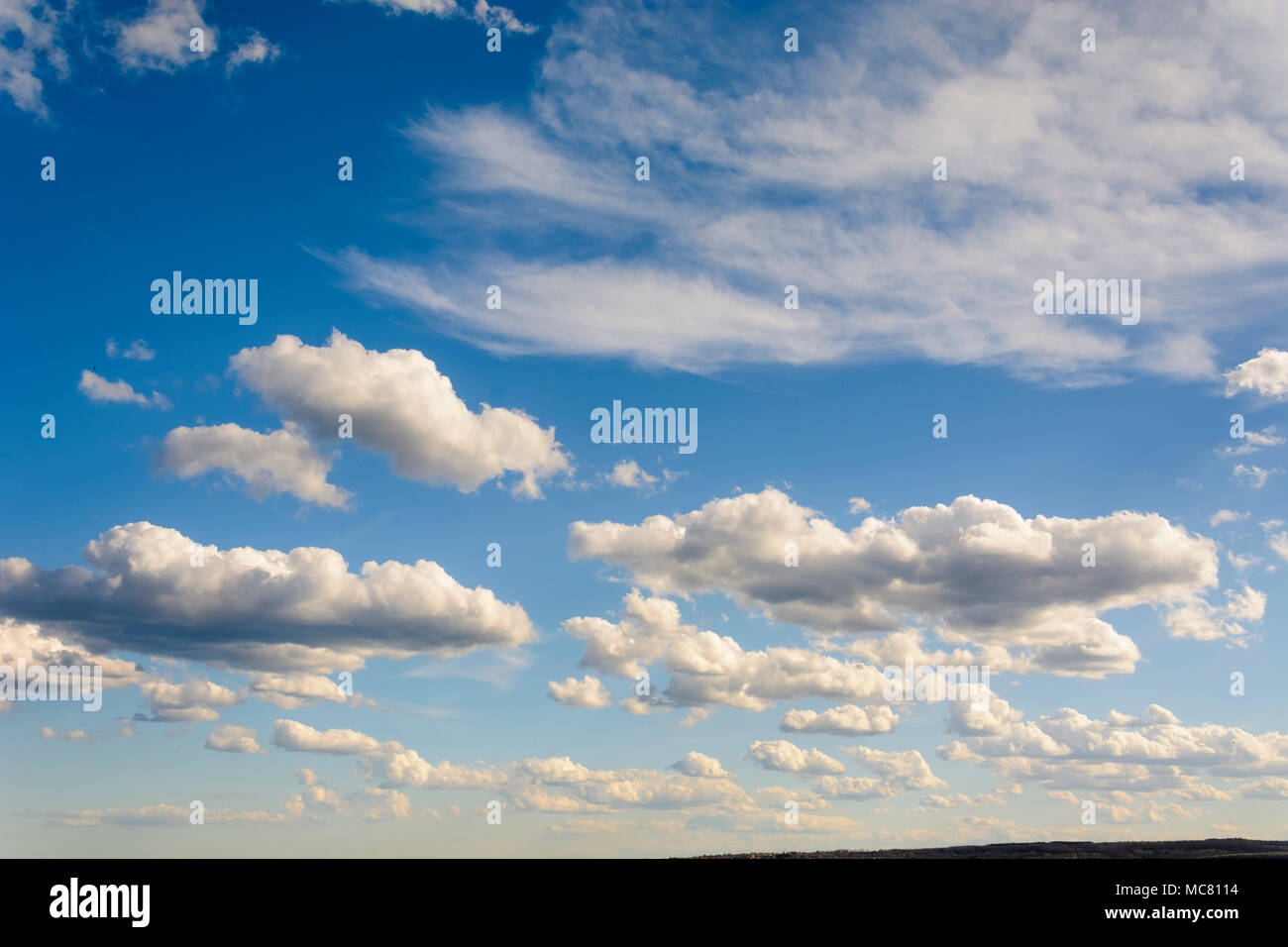 Sunny blue sky with clouds in spring time Stock Photo - Alamy