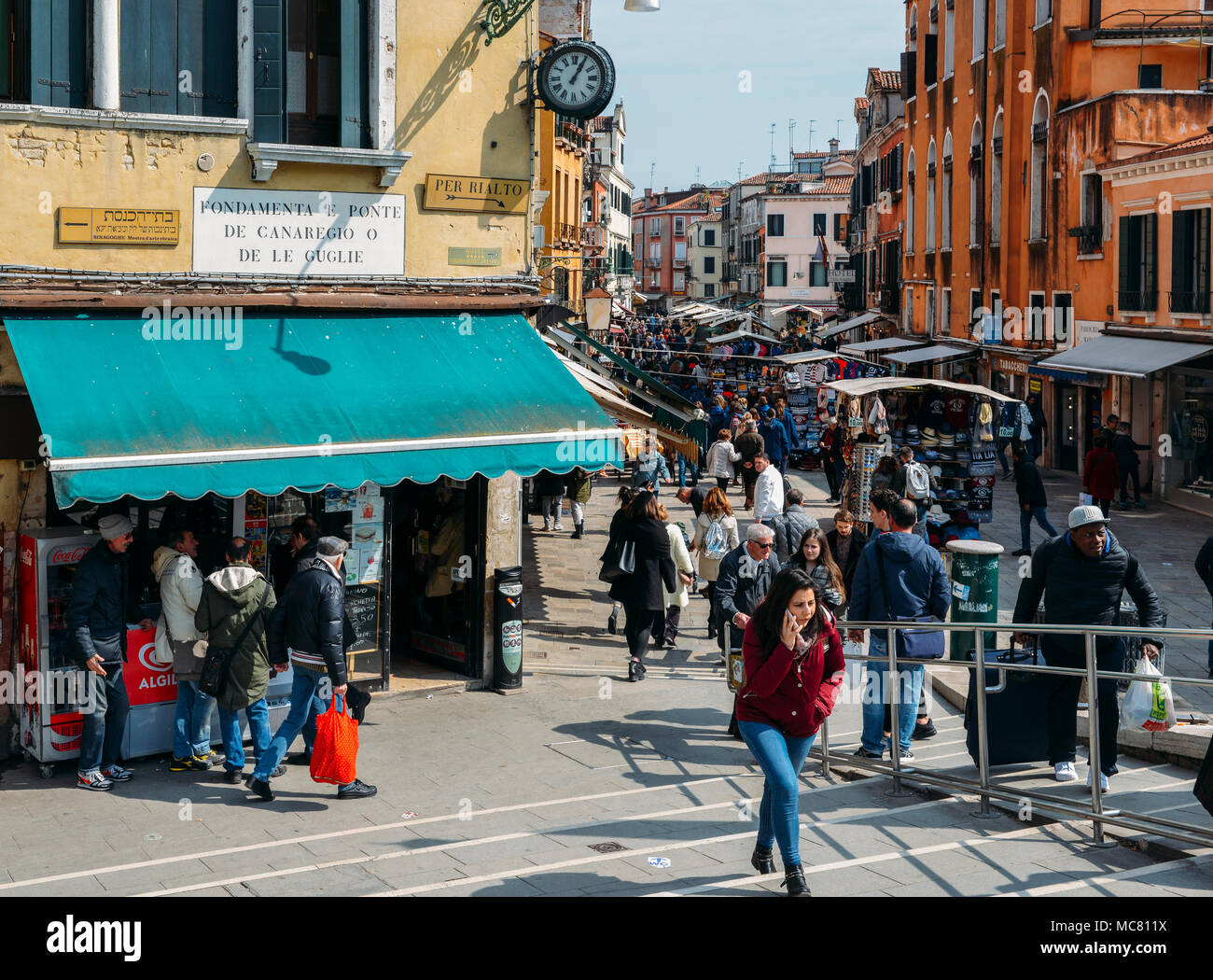 Venice, Italy - March 28, 2018: Pedestrians walk on busy street in the ...