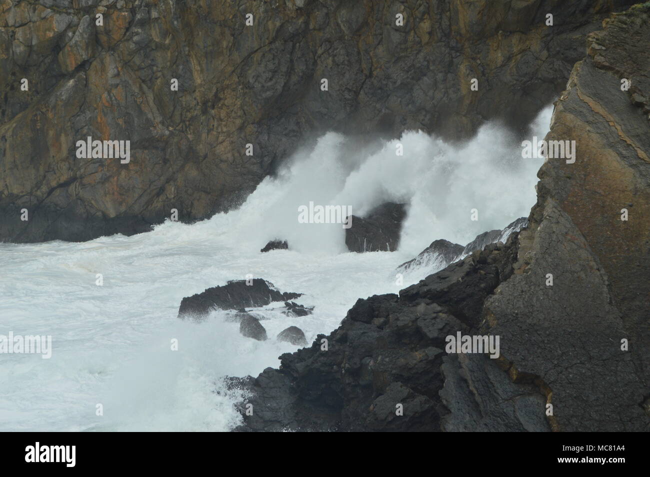 Brave Waves Breaking Against The Rocks Where The Hermitage Of San Juan ...