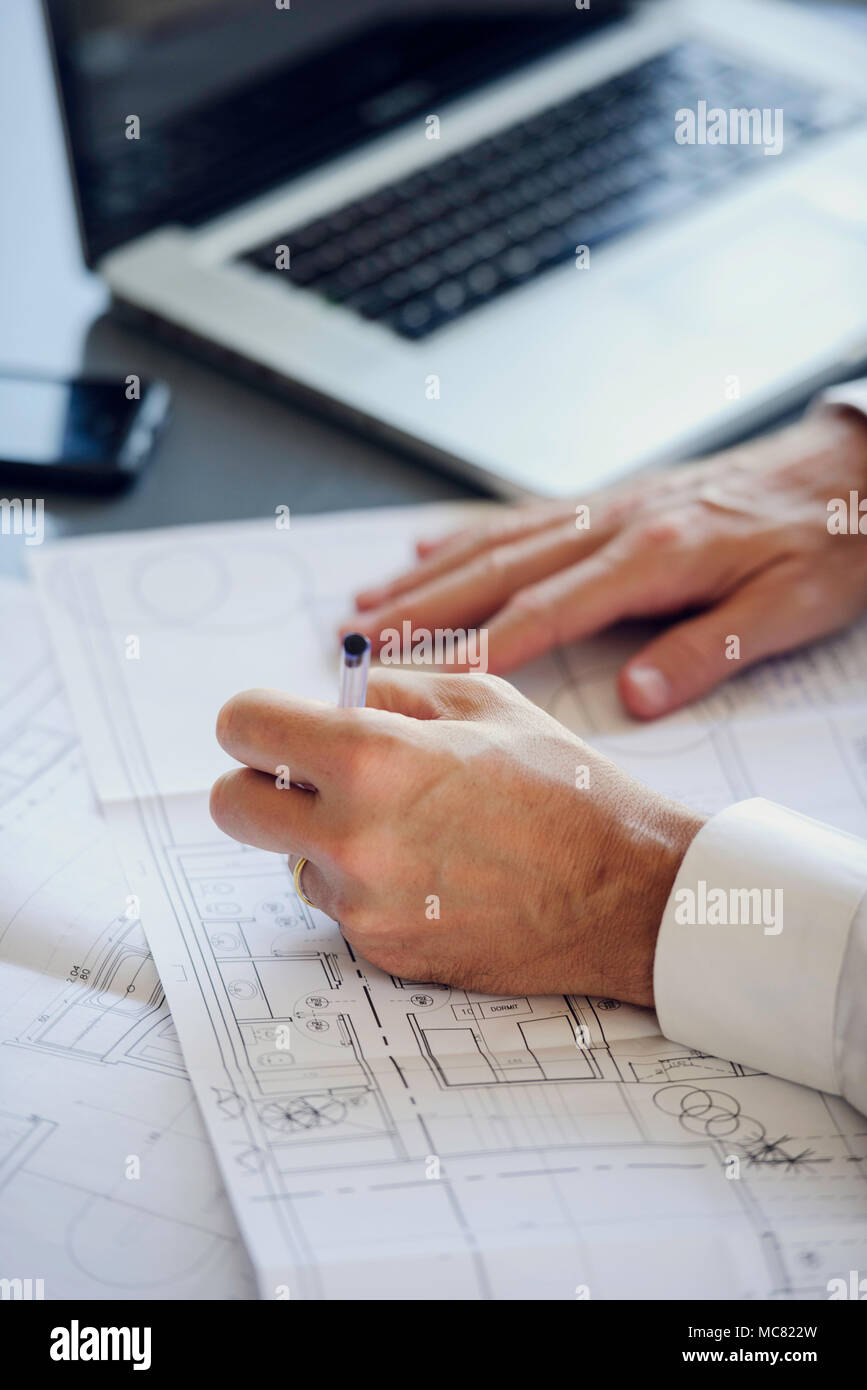 Man working with blueprints Stock Photo - Alamy