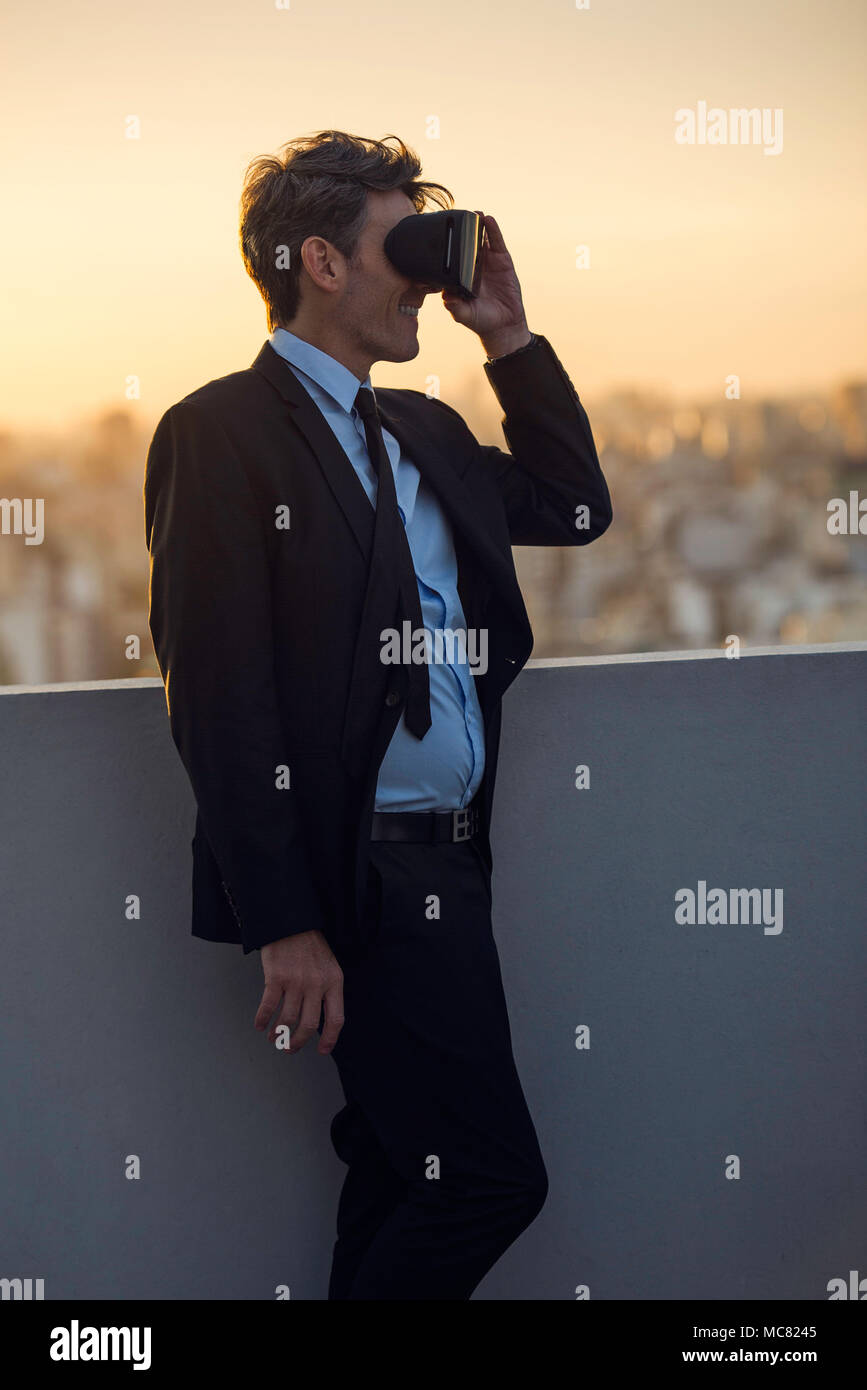 Man using virtual reality headset outdoors Stock Photo - Alamy