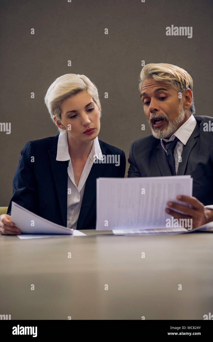 Collaborating man woman reviewing hi-res stock photography and images ...