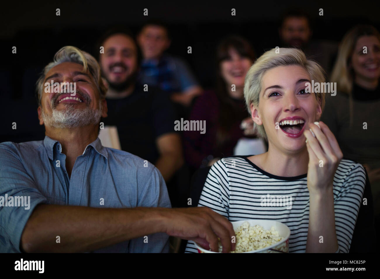 Couple watching movie together Stock Photo - Alamy