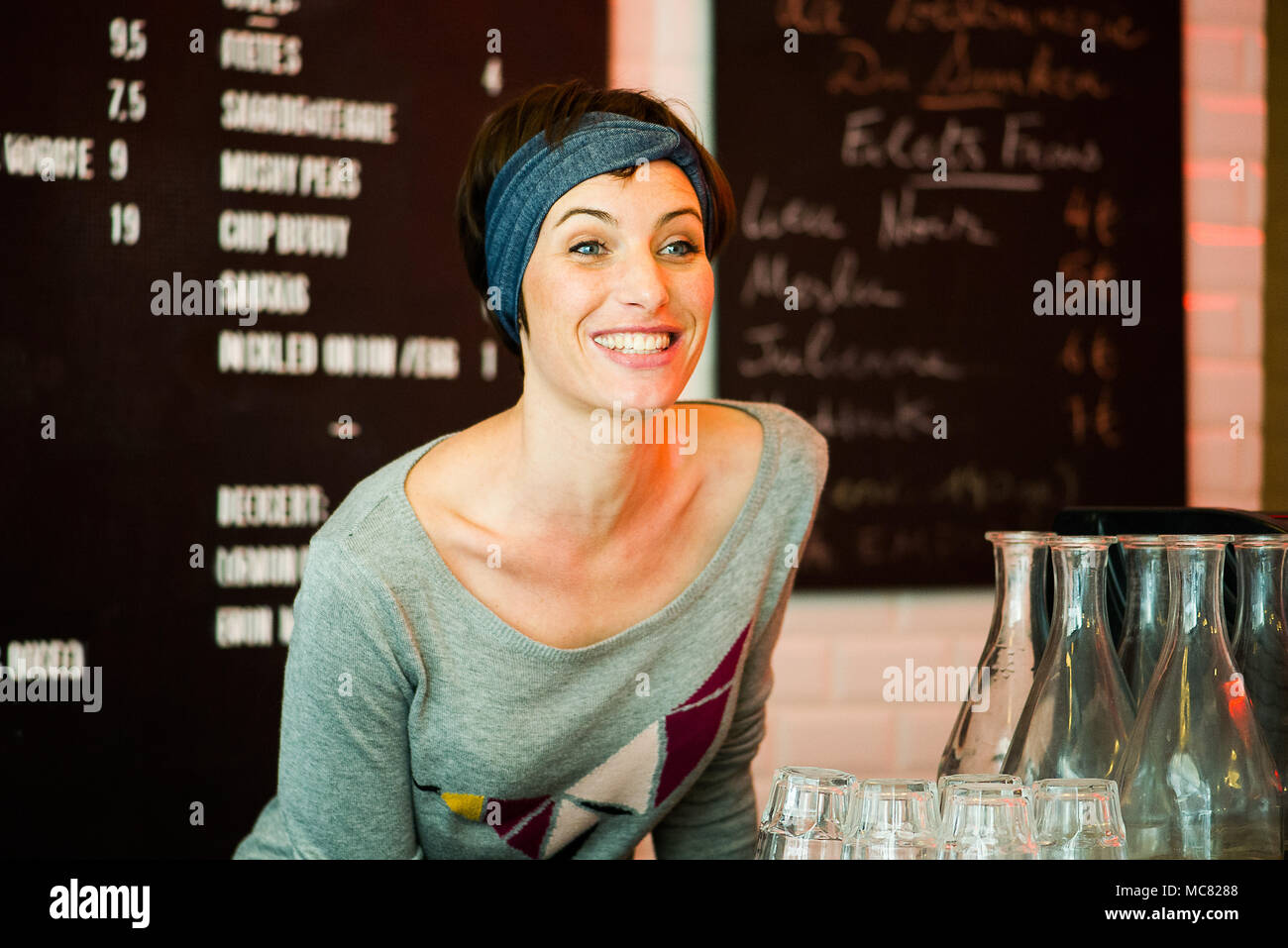 Portrait waitress leaning counter hi-res stock photography and images ...