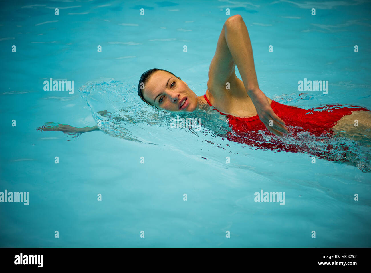 Woman swimming in pool Stock Photo - Alamy