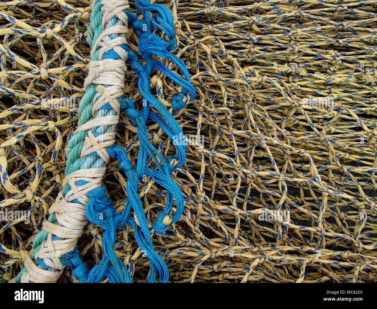 Yellow and Blue Fishing Net Display Textured Background Stock Photo - Alamy