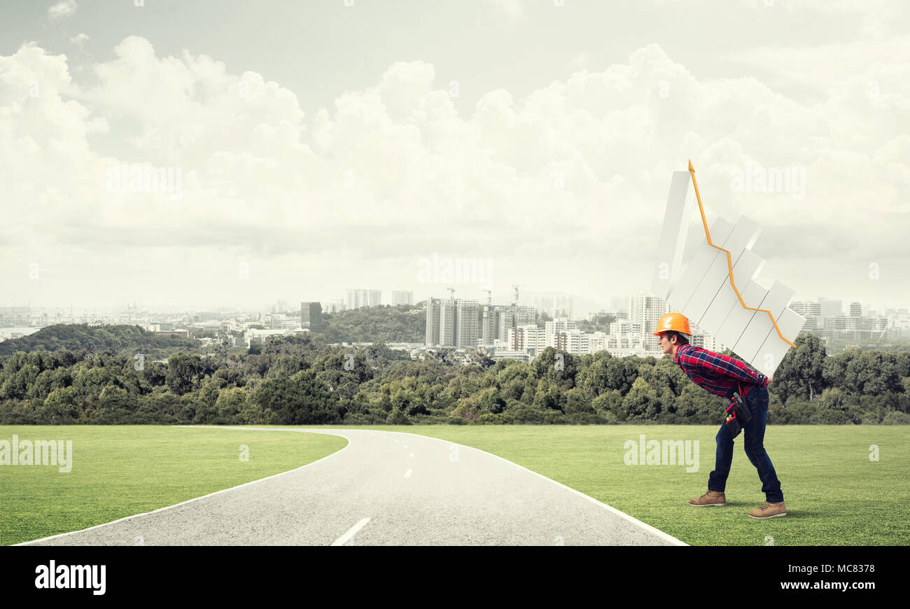 Engineer man carry progress graph Stock Photo - Alamy