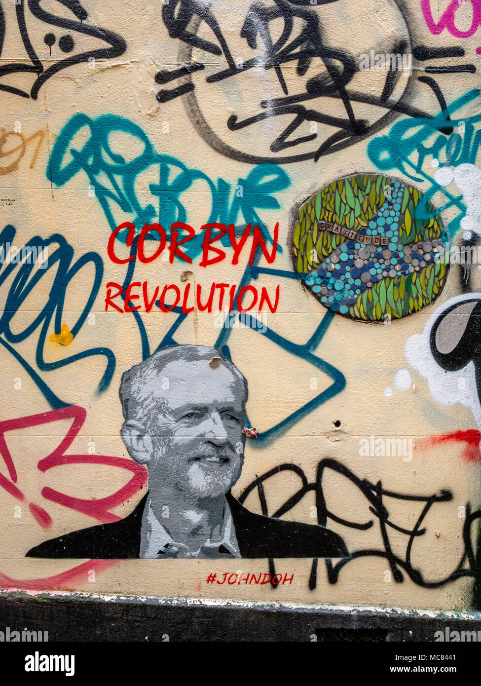 Street art featuring Labour Party leader Jeremy Corbyn in a narrow ...