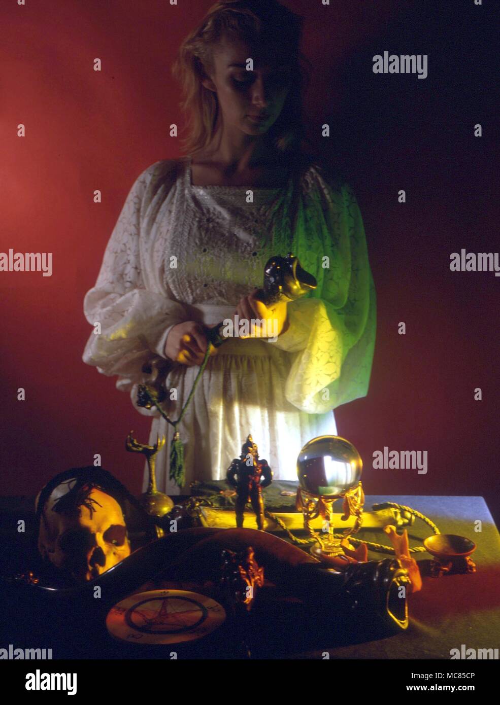 Witchcraft. Wiccan members in front of a isplay of ritual objects ...