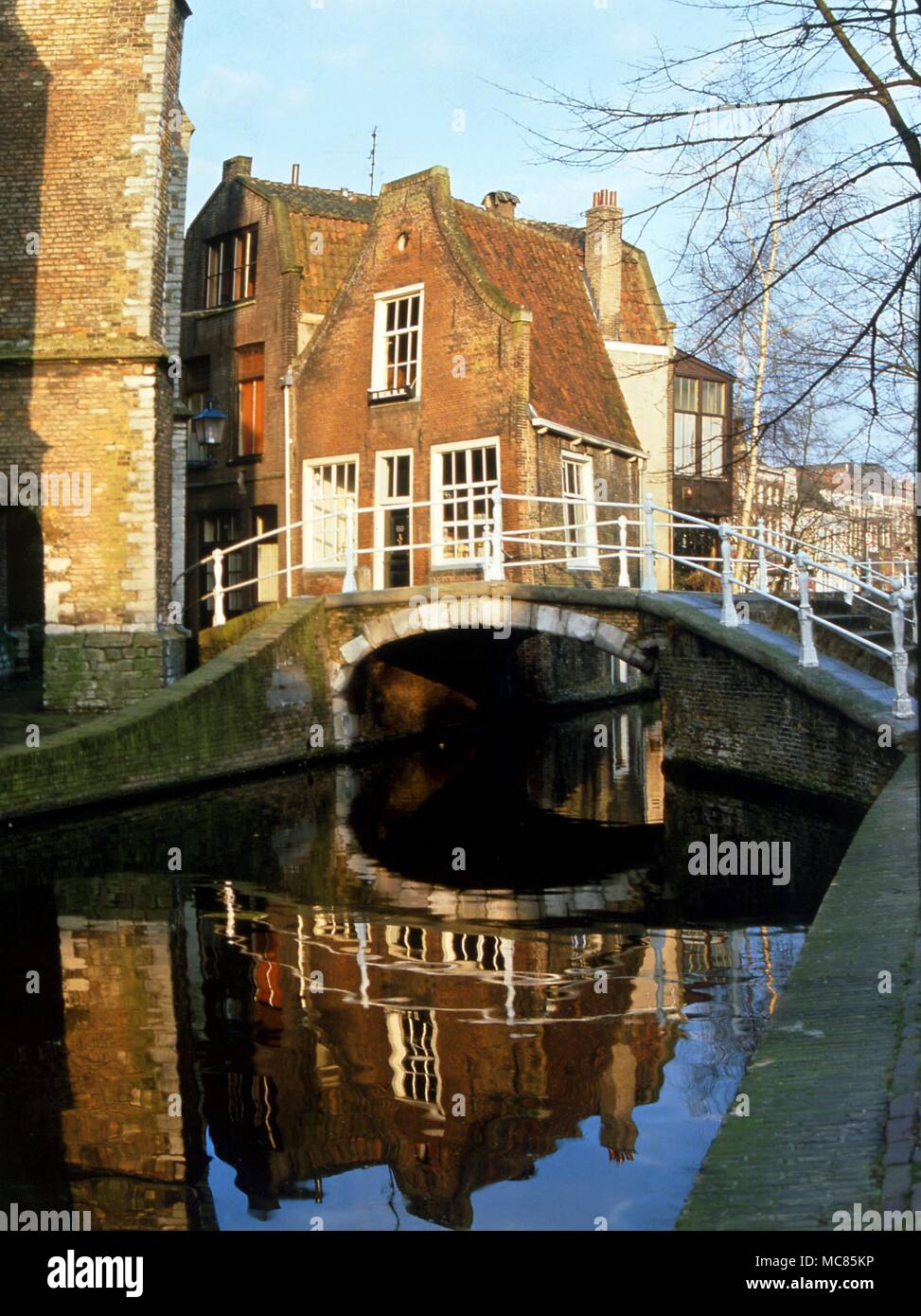 Seventeenth century buildings and canal bridge in Delft, Holland Stock ...