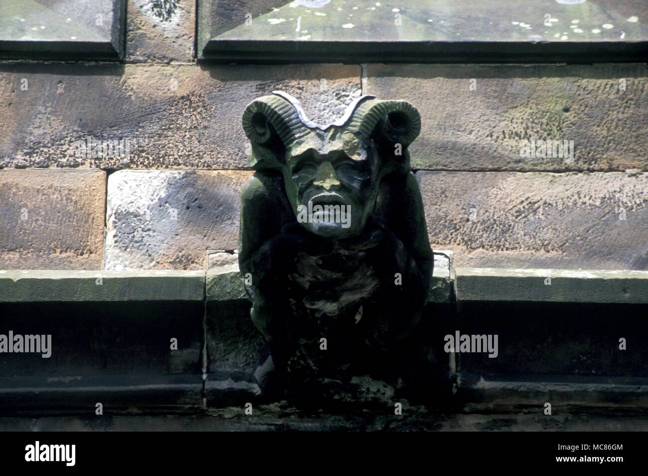 GARGOYLE Demonic gargoyle on the south wall of the parish church ...