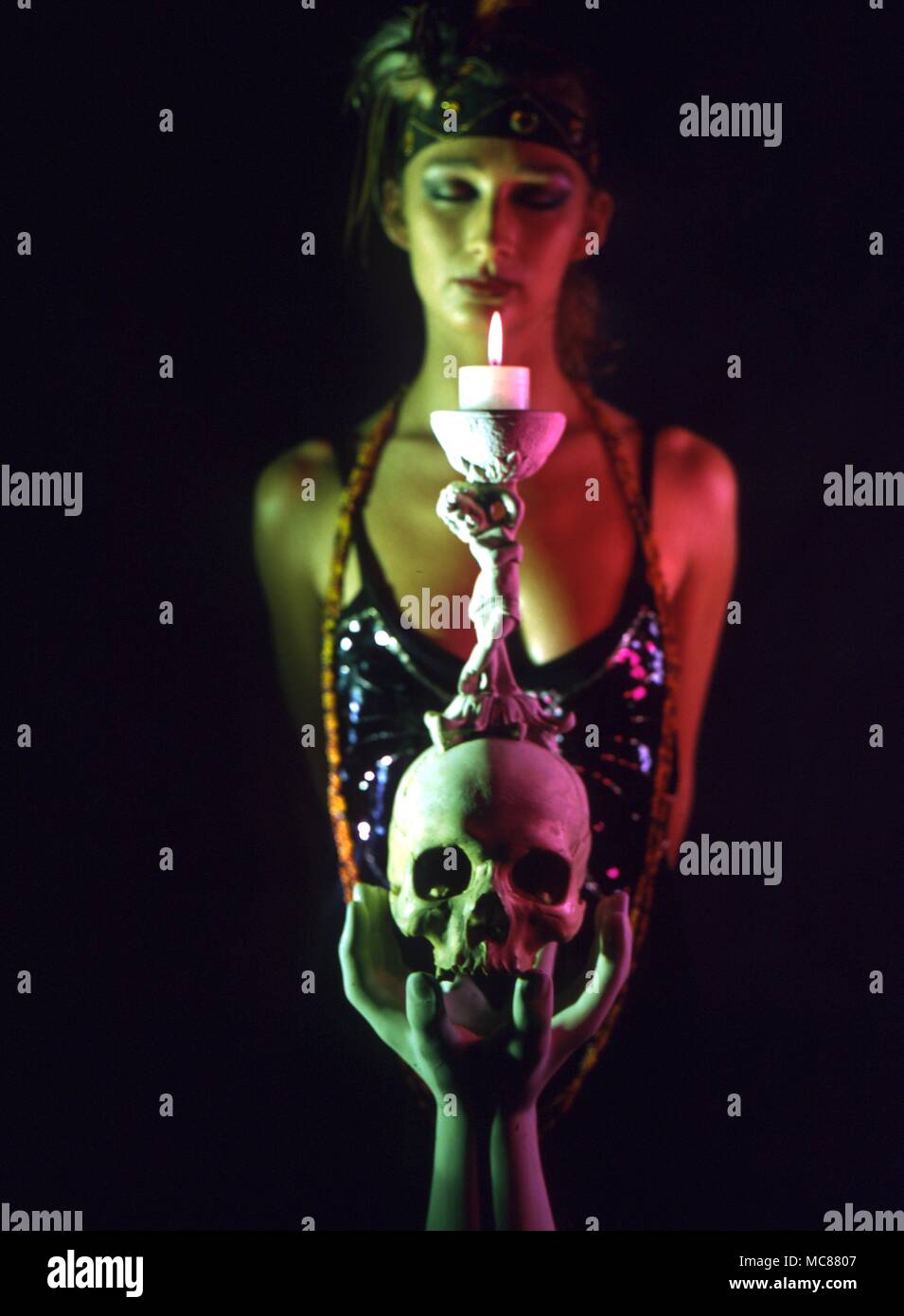 Divination Pyromancy Woman burning candle as part of a pyromancy ritual ...