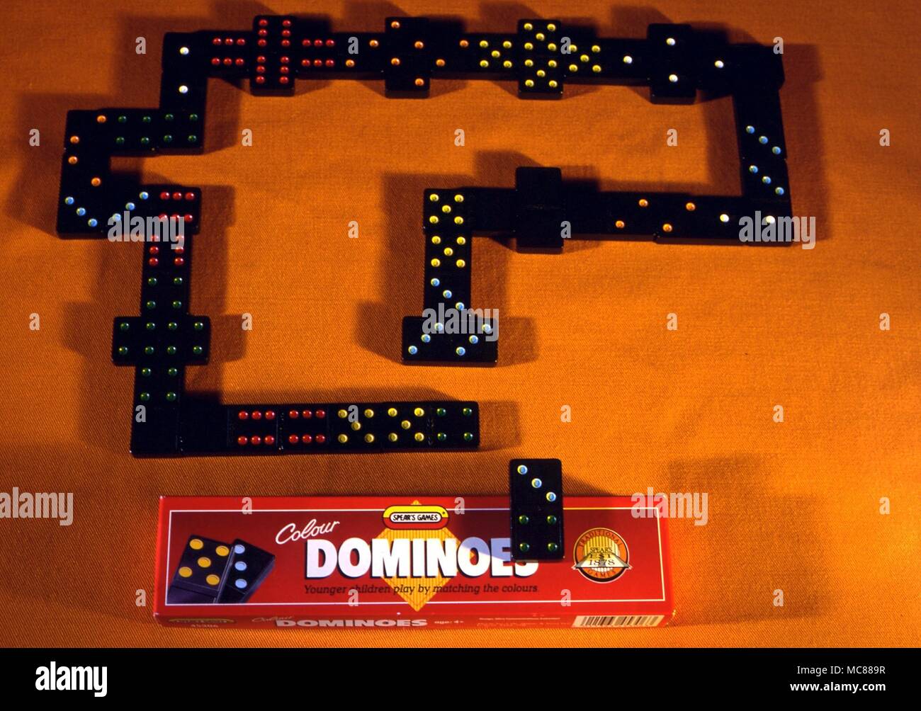 GAMES A line of dominoes Stock Photo - Alamy