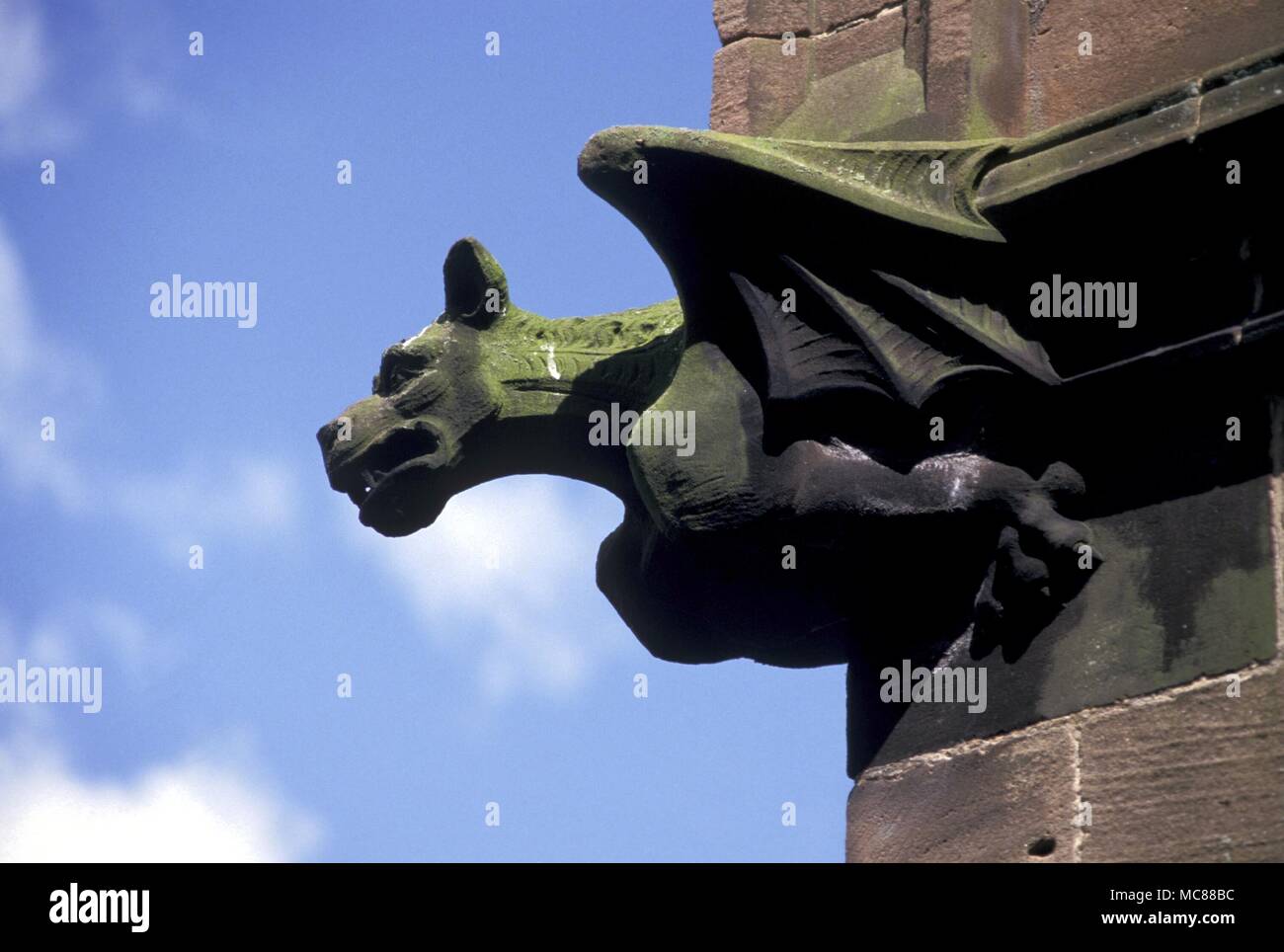 GARGOYLE Medieval gargoyle on the wall of Bunbury parish church Stock ...