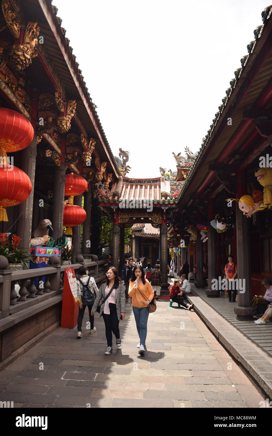 People walking inside Longshan buddhist temple in Taipei, Taiwan Stock ...