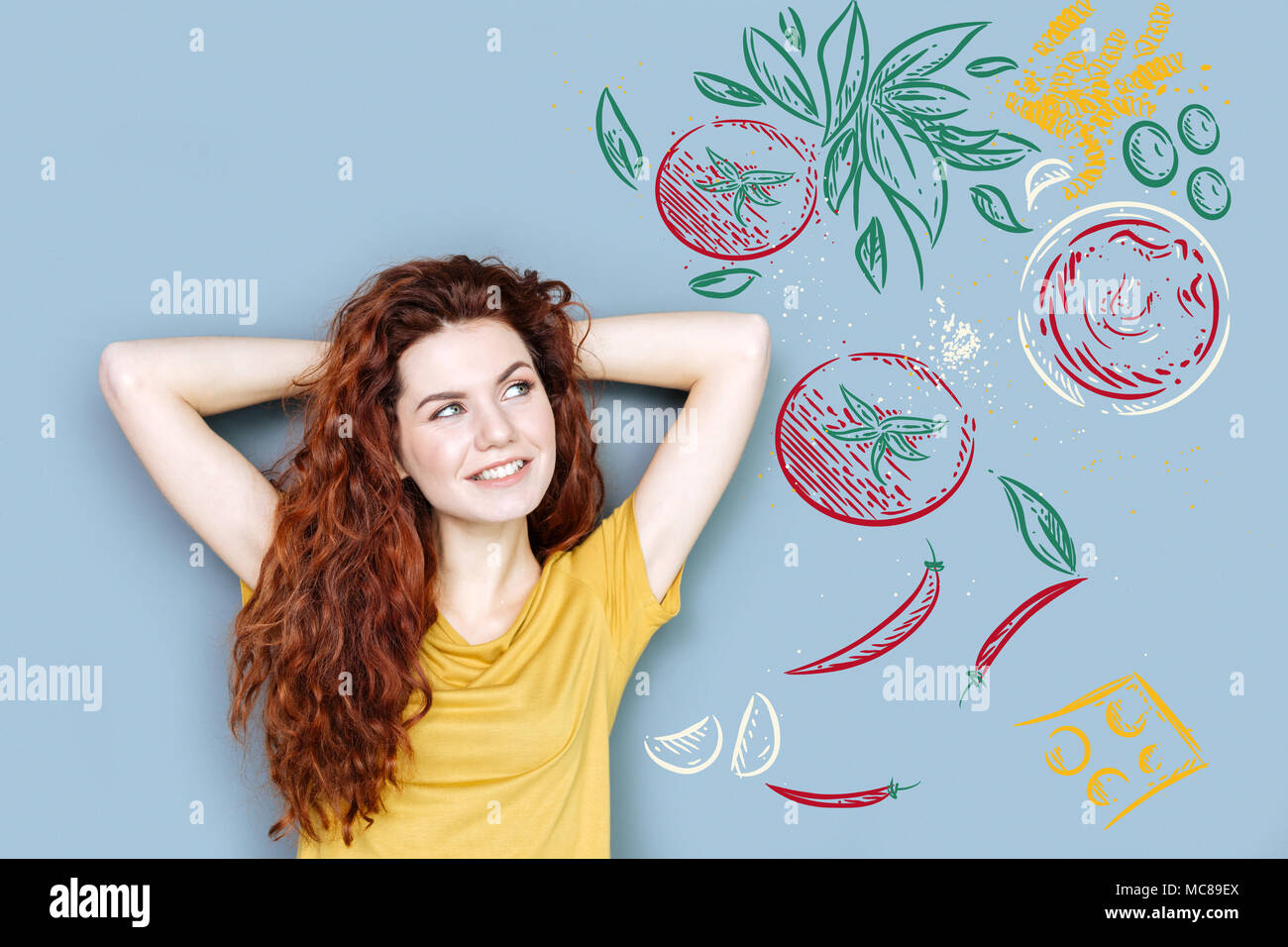 Positive young cook smiling while thinking about necessary ingredients ...