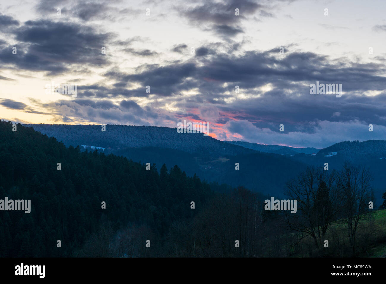 Germany, Remote black forest nature landscape with dramatic sunset sky ...