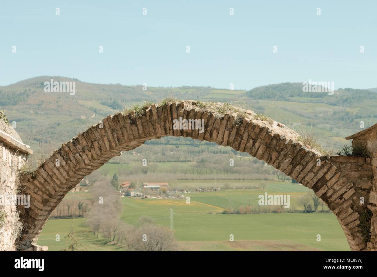 Round brick arch and an italian landscape (Spello, Umbria, Italy Stock ...