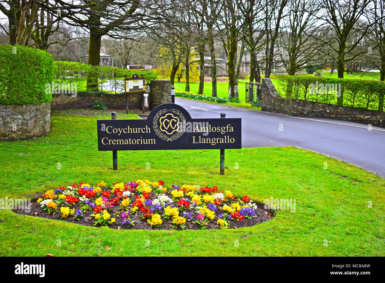 Beautiful & colourful border flowers in front of the bilingual sign for ...