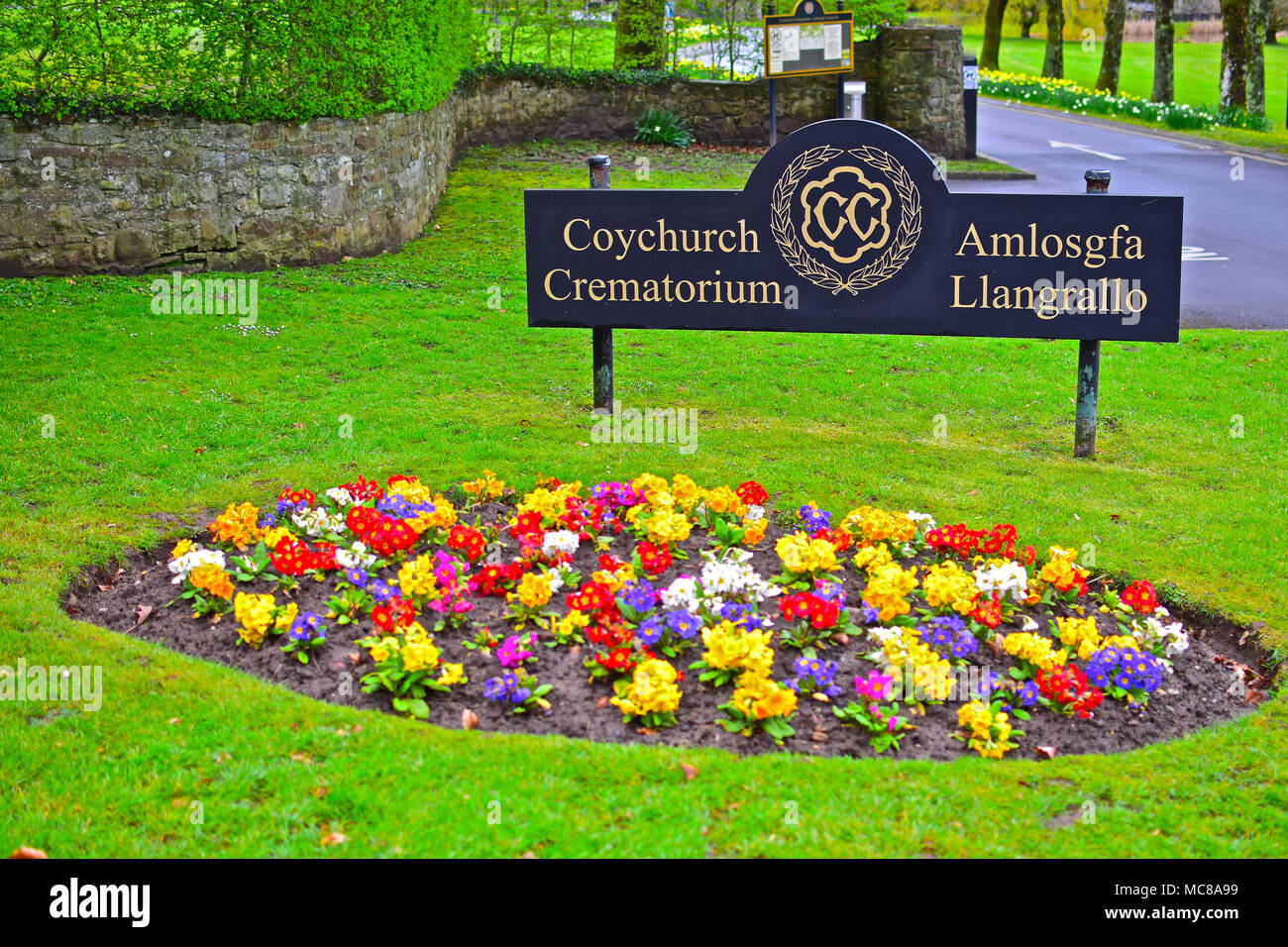 Beautiful & colourful border flowers in front of the bilingual sign for ...