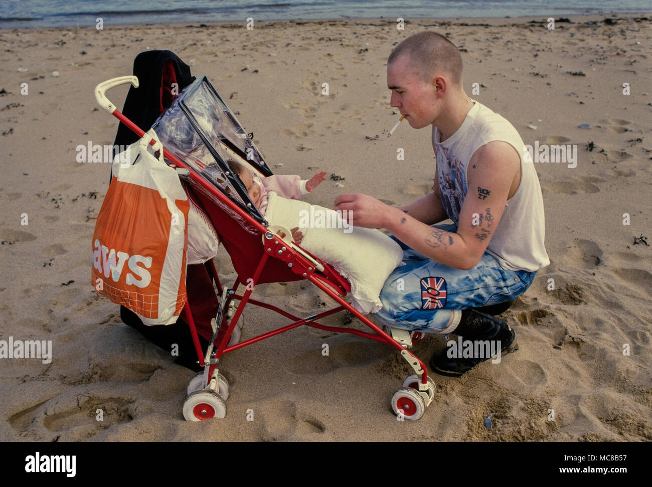 Tynemouth Tyne and Wear England UK. A young man attends his baby on ...