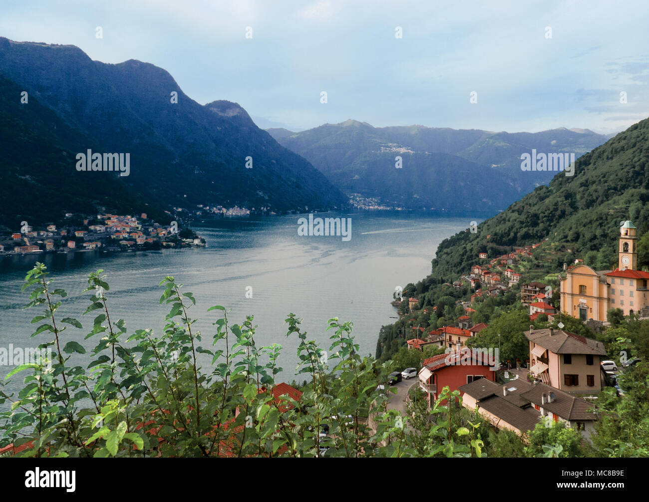 the green spring mountains frame Lake Como in April. Italy Stock Photo ...