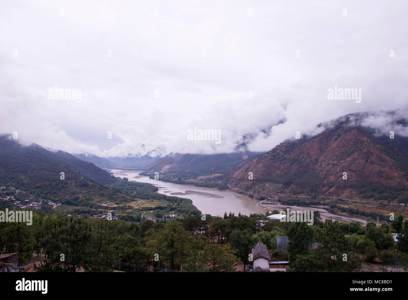 Cloudy day mountain Yangtze river in Yunnan Province, China Stock Photo ...