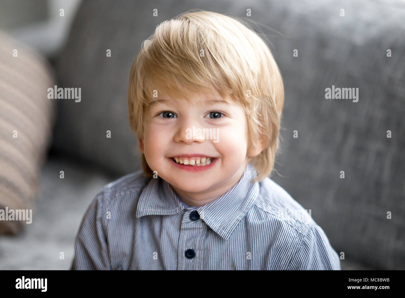 Head shot of cute little boy, happy funny child with blond light hair ...