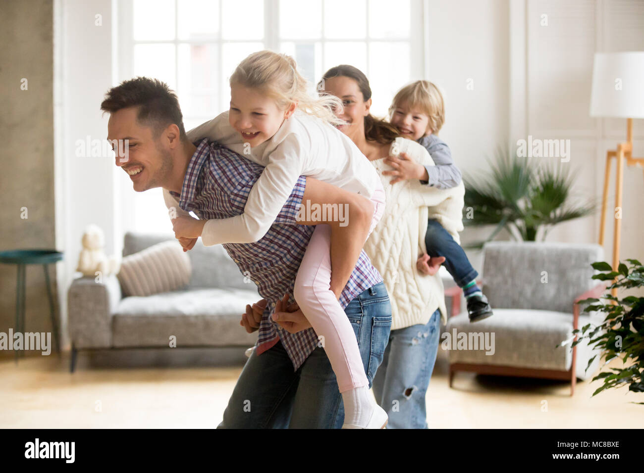 Mother carrying children on back hi-res stock photography and images ...