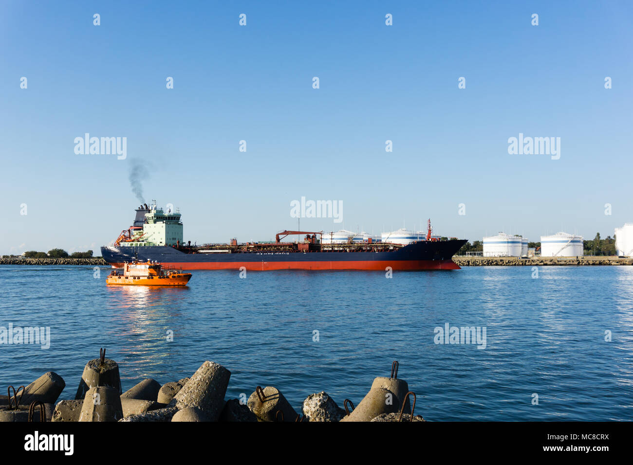 ship crossing sea gates at Baltic sea port Klaipeda, Lithuania in ...
