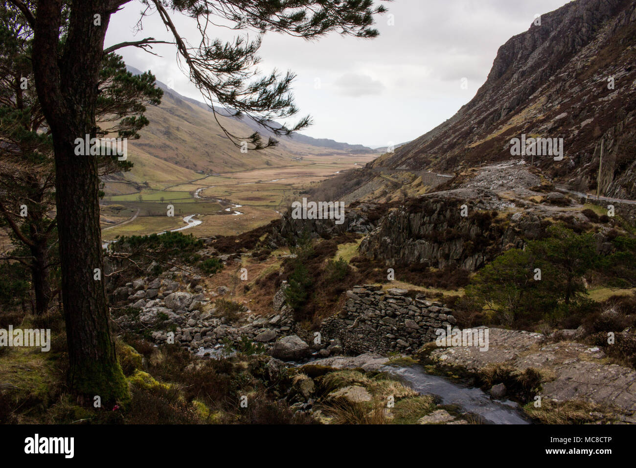 welsh snowdonia showing a waterfall which becomes the winding center ...