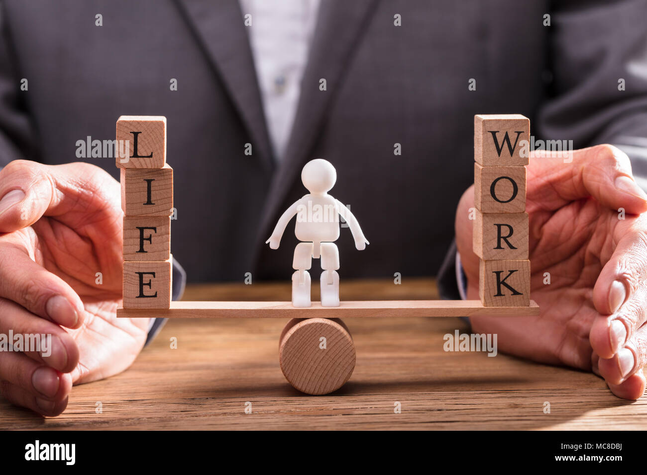 Human Figure Standing Between Work And Life Wooden Blocks On Seesaw ...